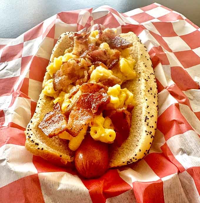 Mac and cheese meets bacon on a hot dog because sometimes life demands you stop playing it safe.