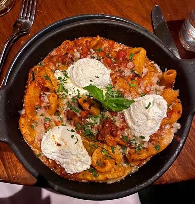 Rigatoni swimming in rich Bolognese with clouds of fresh ricotta looks like comfort food went to finishing school.