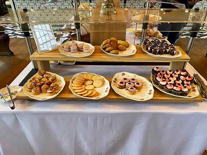 This tiered dessert display showcases cookies, cakes, and pastries that could make a bakery owner weep with envy.