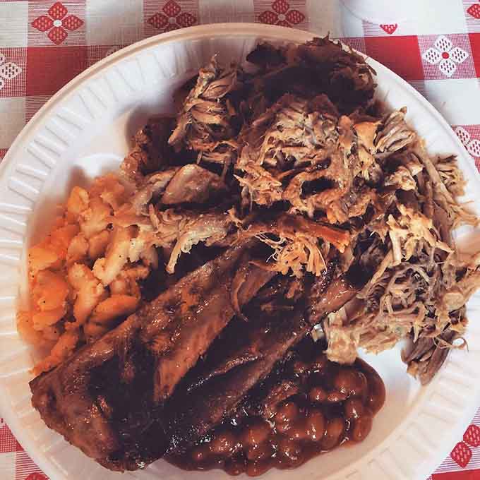 This plate looks like someone took all your barbecue dreams and made them real, with extra helpings of happiness.