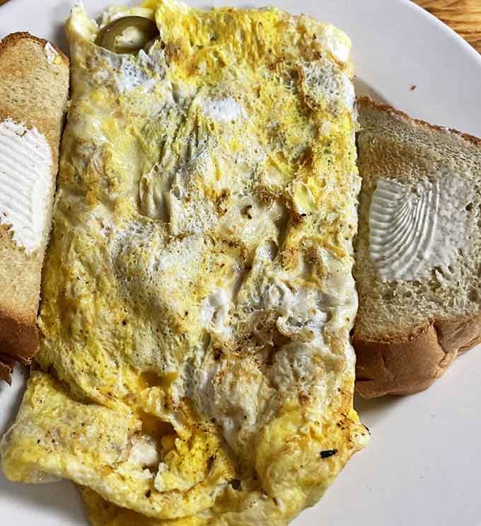 Behold the omelet that proves simplicity and skill create breakfast perfection worth waking up for every time.