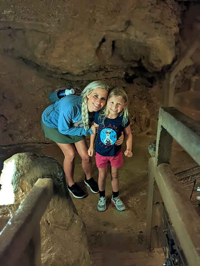 Underground family bonding where the only screen glow comes from strategically placed lights illuminating ancient stone.