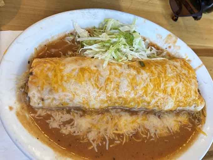 Behold the smothered breakfast burrito: a golden, cheese-covered monument to everything right about Colorado mornings and green chile.