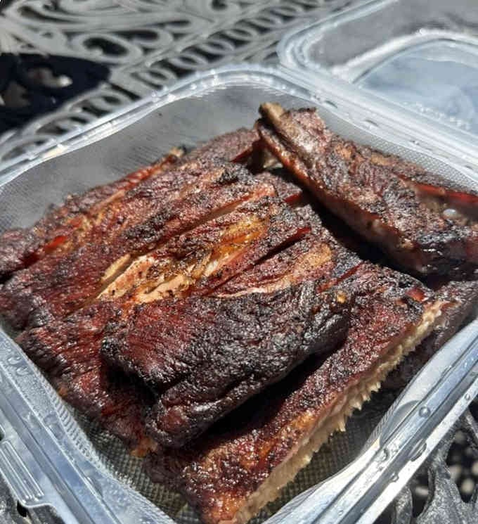 That bark on those ribs looks like it could tell stories about hours spent in smoke.