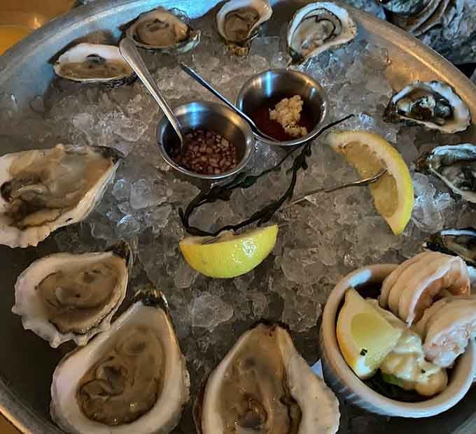 Fresh oysters glistening on ice with mignonette and lemon wedges&mdash;proof that great seafood knows no geographical boundaries whatsoever.