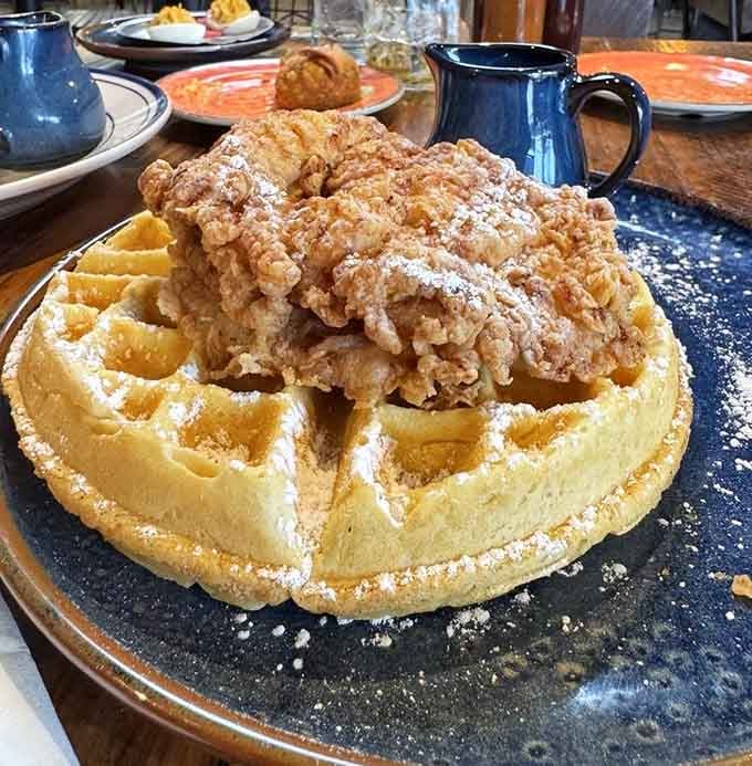 Behold the chicken and waffles in all their golden, crispy, powdered-sugar-dusted glory, ready to change your life forever.