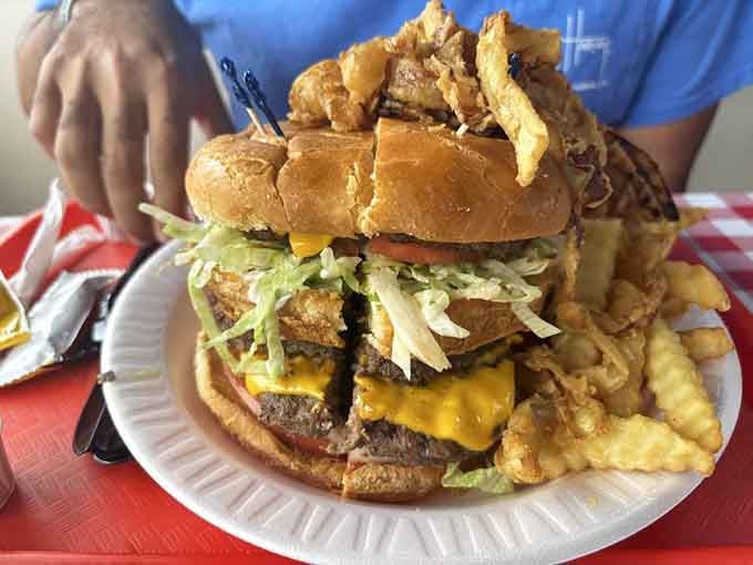 When they stack a burger this high, they're not showing off, they're making a statement about portion philosophy.