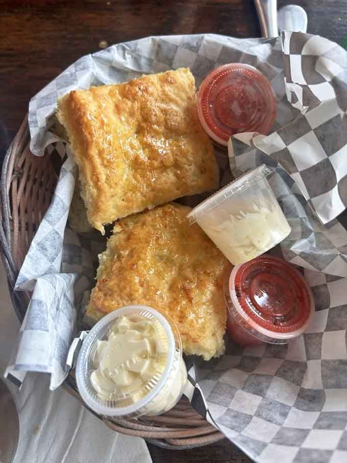 Two golden biscuits with honey and jam prove that simple perfection never goes out of style, folks.