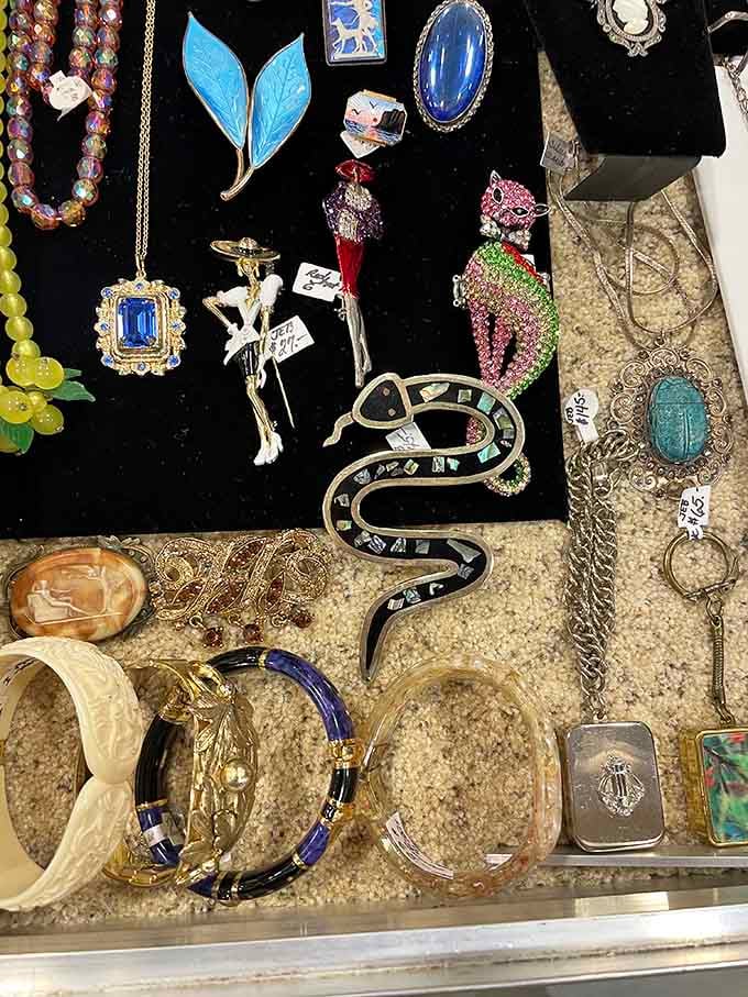 Vintage brooches and bangles glitter like a jewelry box exploded in the most delightful way imaginable.