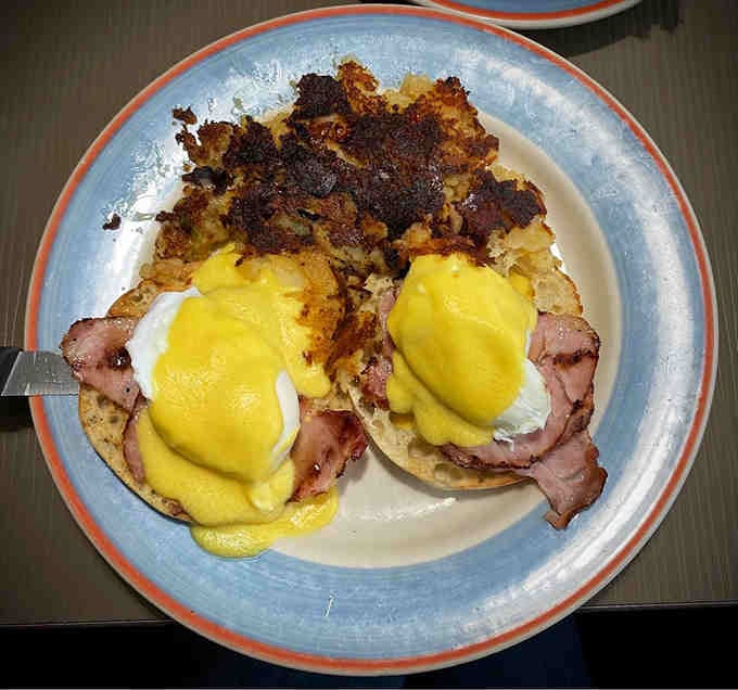 Eggs Benedict with hollandaise that doesn't quit, perched on English muffins like they own the place.