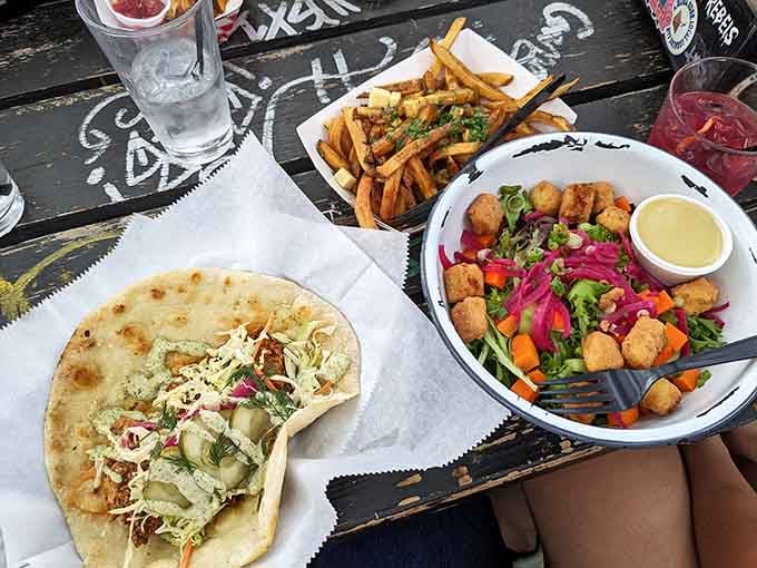 Tacos, crispy fries, and golden tots arrive ready to fuel your evening of spooky shenanigans and good times.