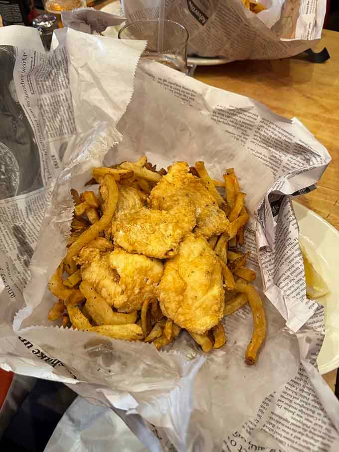 Golden, crispy, and served on newspaper like the good old days, this is fish and chips done absolutely right.