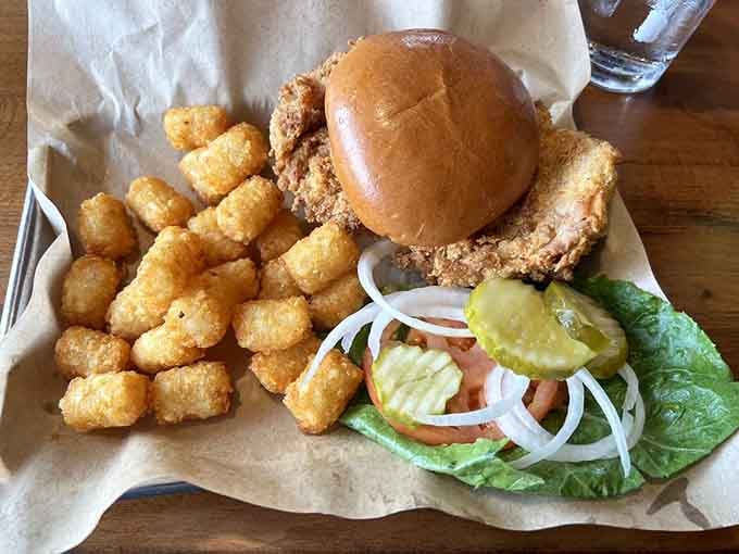That pork tenderloin is so big it makes the bun look like it's attempting an impossible mission.