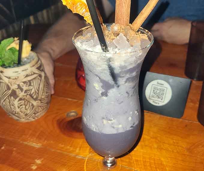 This frosty beauty arrives looking like a tropical sunset decided to take liquid form in your glass.