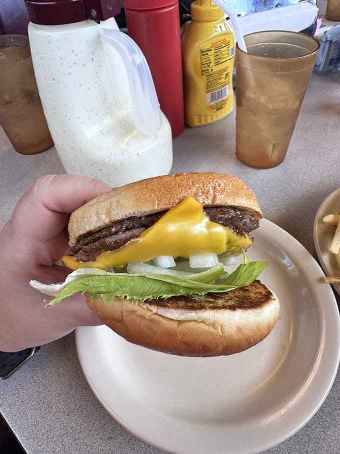 When cheese drapes over a burger like a golden blanket, you know someone in that kitchen truly cares.
