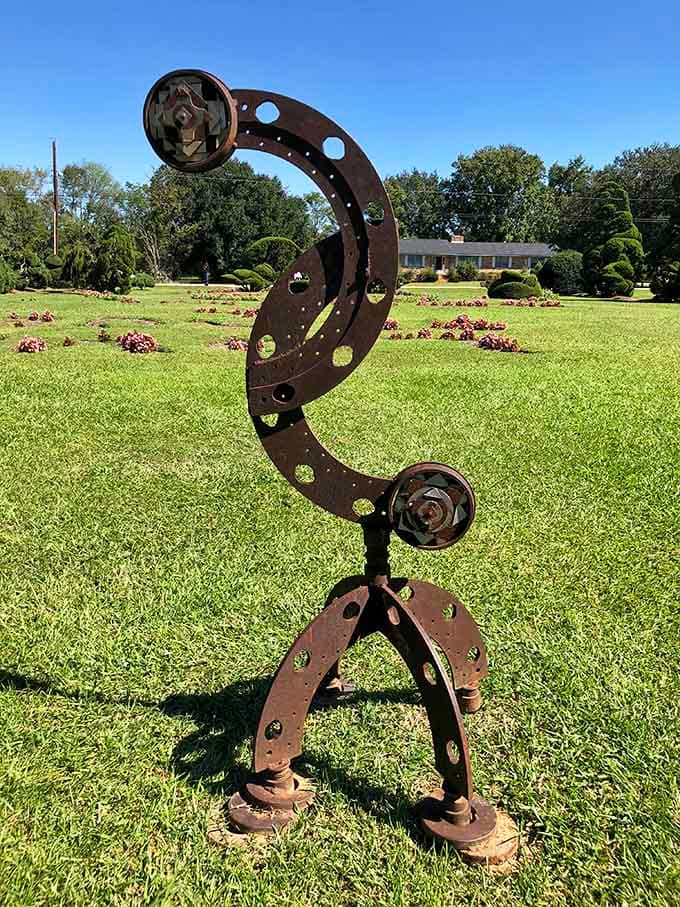 Abstract steel dancing across the lawn&mdash;because even the non-plant art wanted to join this extraordinary party.