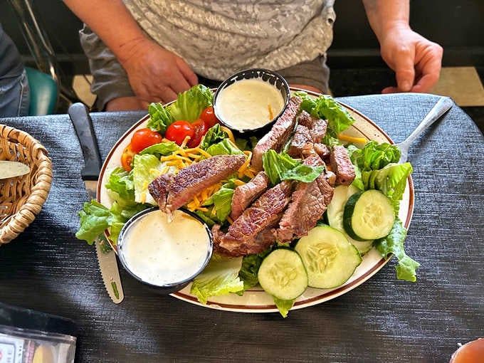 When your salad comes with sliced steak, you know someone understands that vegetables need proper supervision and companionship.