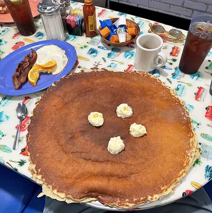 Behold, the pancake that launched a thousand Instagram posts and approximately zero regrets about elastic waistbands.