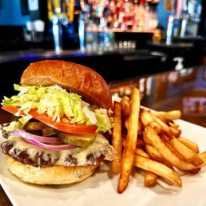 Look at that perfectly melted cheese cascading over the patty like a delicious dairy waterfall of happiness.