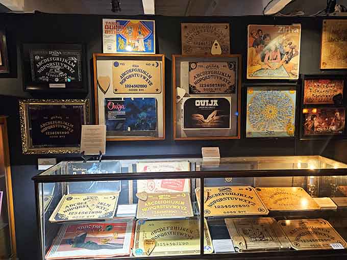 Vintage Ouija boards line the walls like portals to another era of parlor entertainment and spiritualism.