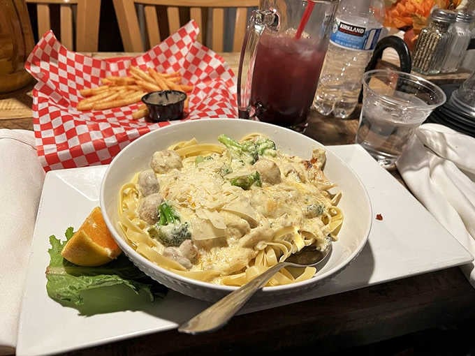 Creamy chicken fettuccini that could make an Italian grandmother nod in approval, served with garlic bread and perfectly crispy fries.