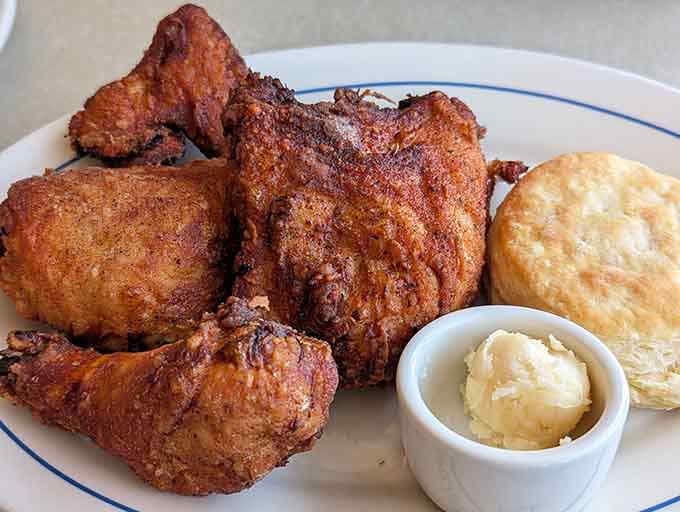 Golden, crispy perfection with a fluffy biscuit and butter&mdash;this is what fried chicken dreams are made of.