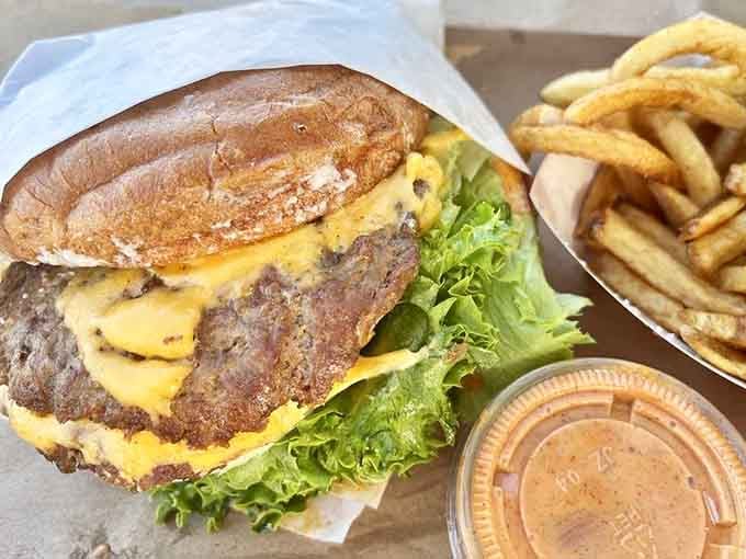 Two patties, melted cheese, and fresh lettuce that actually looks like it came from a garden.