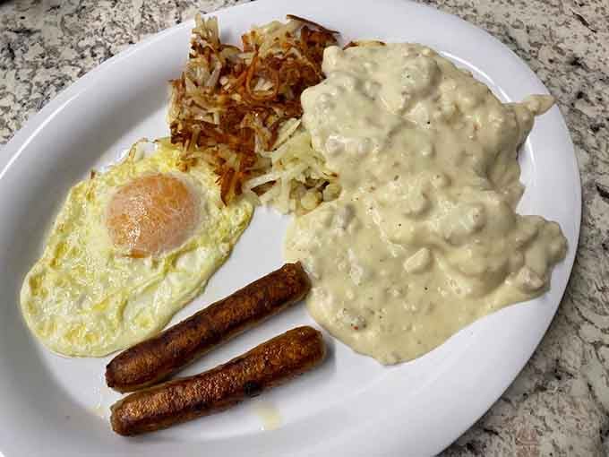 Biscuits drowning in sausage gravy alongside perfectly cooked eggs: this is what breakfast dreams are made of, folks.