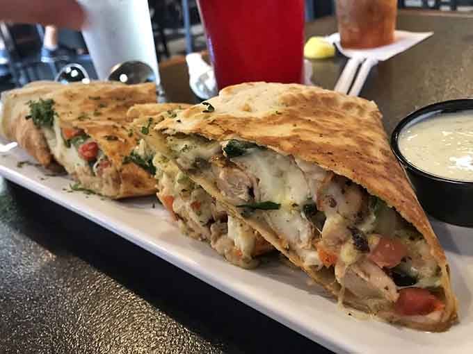 That breakfast quesadilla is stuffed so generously, it's practically bursting with morning glory and melted cheese perfection.