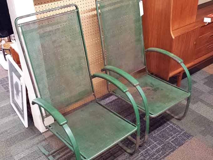 Mid-century metal chairs that have probably supported more summer conversations than your therapist ever will.