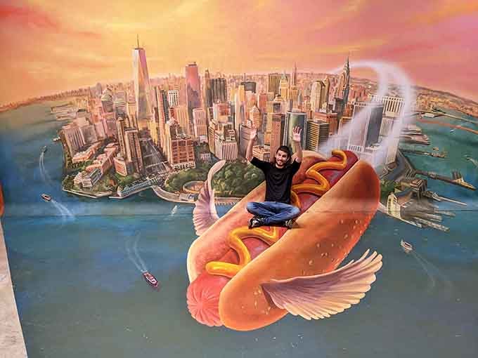 Riding a flying hot dog over a cityscape &ndash; because sometimes the most absurd photos make the best memories.