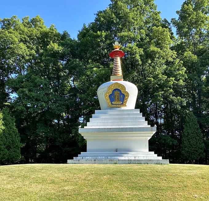 The white stupa rises from the lawn like a beacon of peace, reminding you that serenity exists beyond your inbox.