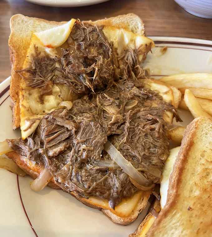 Tender shredded short ribs piled high on toast prove that sometimes the best meals require both hands and zero shame.