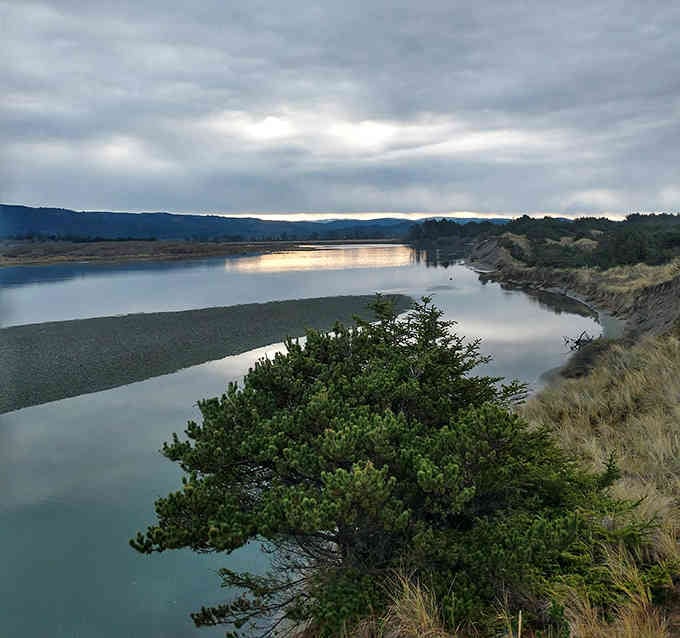 The water reflects the sky like nature's own mirror, creating a scene that belongs on a postcard.