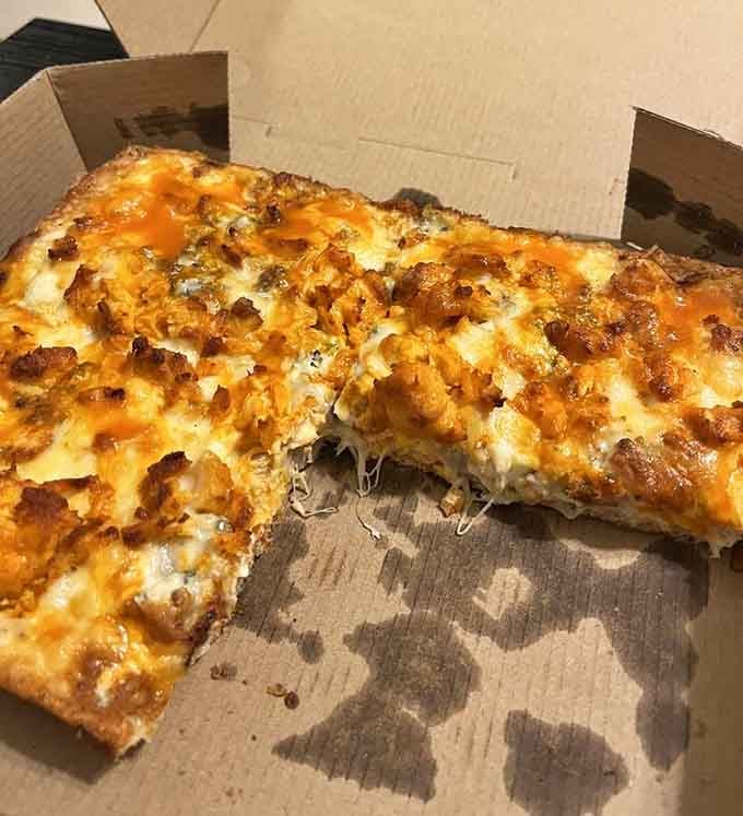 The Buffalo Chicken pizza brings the heat with that gorgeous caramelized cheese edge that Detroit-style is famous for.