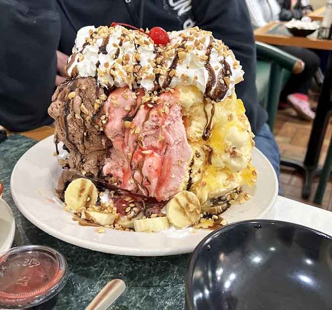 This banana split towers like Everest made of ice cream, challenging both your appetite and your structural engineering knowledge.