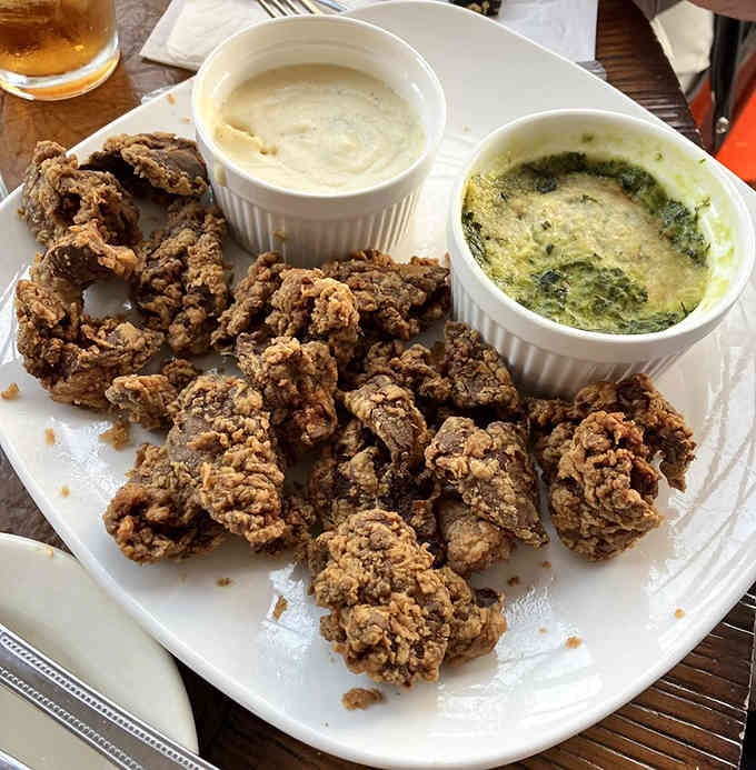 Golden, crispy, and served with multiple dipping sauces because one is never enough for perfection like this.