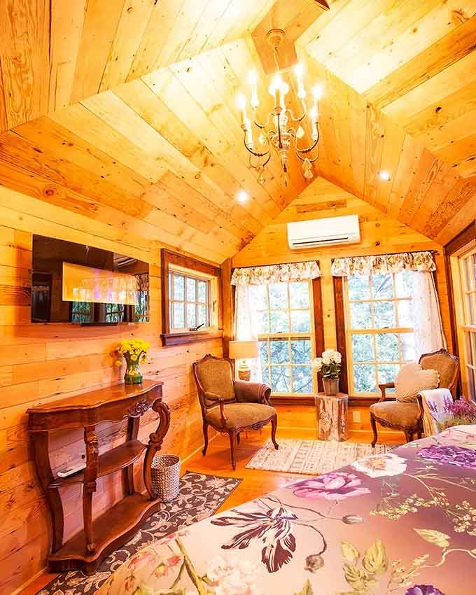 Cathedral ceilings and elegant chandeliers suspended in the trees &ndash; because roughing it should still include a little sparkle.