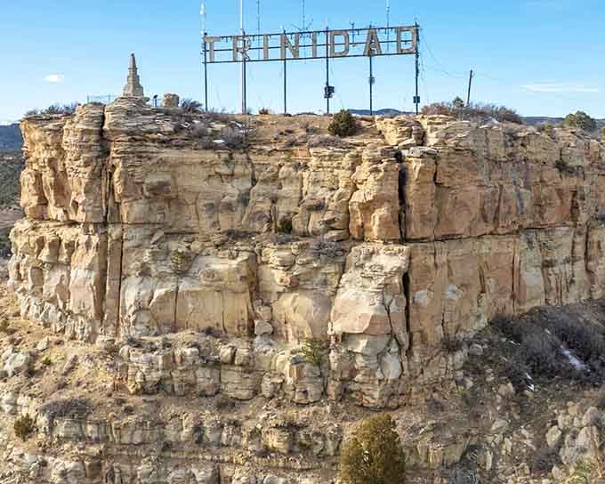 The Trinidad sign perched on sandstone cliffs announces your arrival to Colorado's most budget-friendly hidden gem.