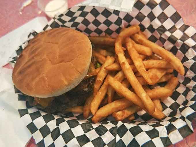 The Cowboy Burger arrives like John Wayne riding into town: bold, satisfying, and impossible to ignore on your plate.