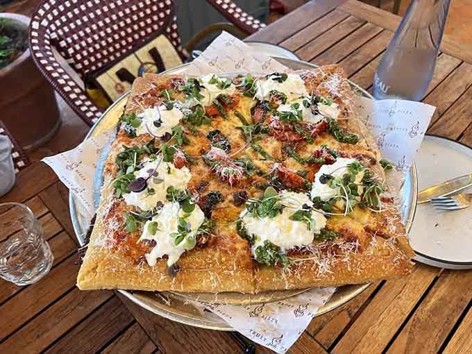 This isn't your average pizza joint when they're topping pies with dollops of creamy goodness and fresh herbs like edible masterpieces.