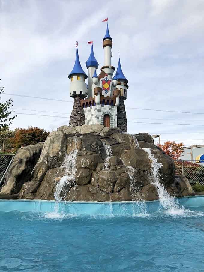 A castle with waterfalls because apparently regular mini golf wasn't whimsical enough for anyone's satisfaction here.