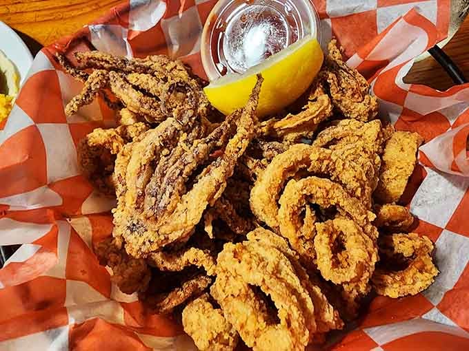 Golden fried calamari rings arrive like edible jewelry, proving squid deserves way more respect than it gets.