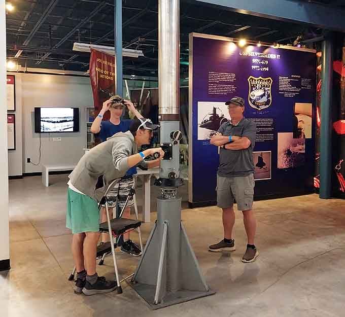Visitors get hands-on with history, peering through equipment that once scanned for enemy vessels.