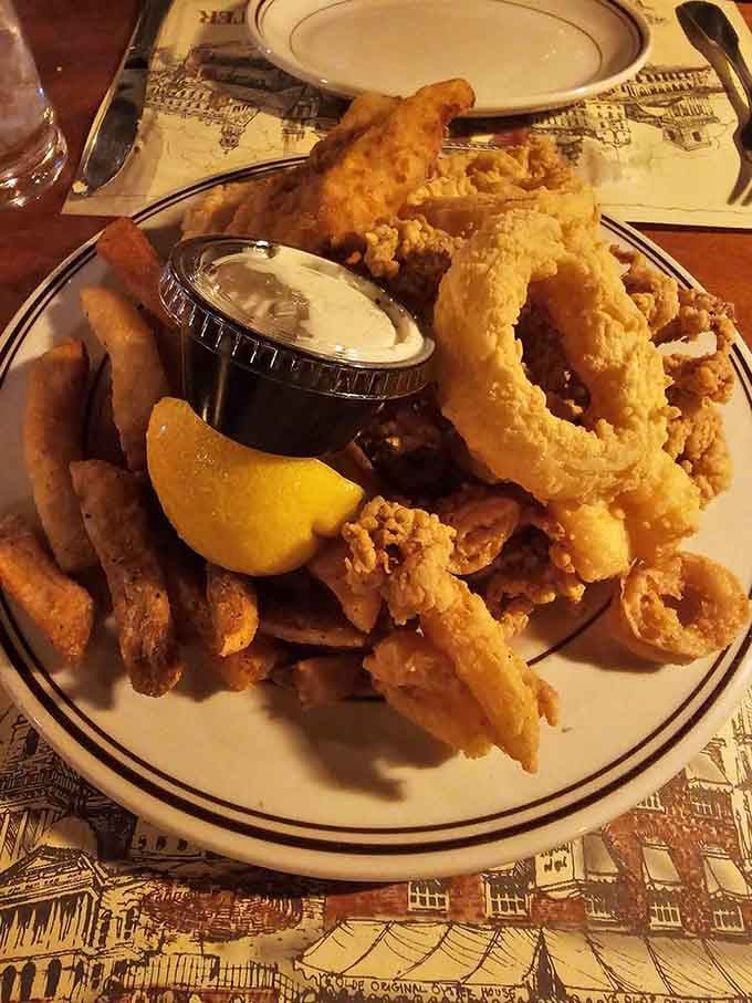 Golden fried seafood piled high like edible treasure from the depths of Massachusetts Bay itself.