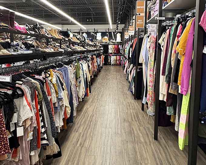 Rows of possibilities stretching into the distance, each hanger holding someone's future favorite outfit at yesterday's prices.