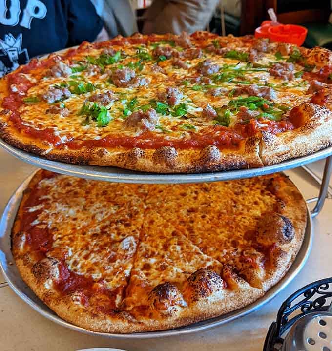 Thin-crust perfection stacked high, because one pizza is never enough at Vic's.