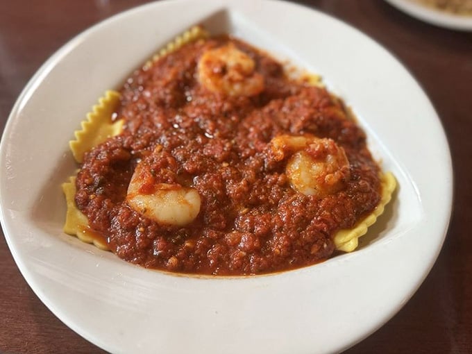 Cheese ravioli swimming in marinara with plump shrimp proves simplicity wins every single time.