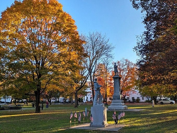 Fall colors frame the town green where monuments remind you that some places still honor their history with dignity.