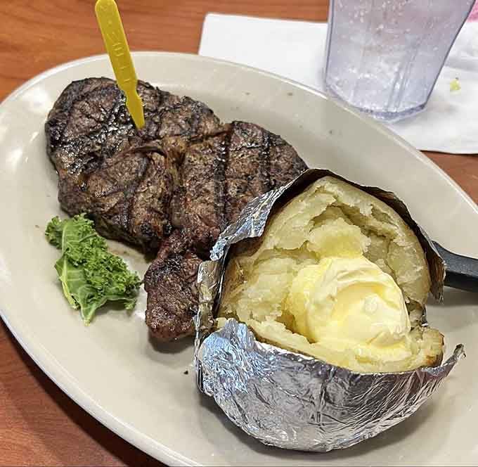 That ribeye with a loaded baked potato is the kind of plate that makes you forget your own name.